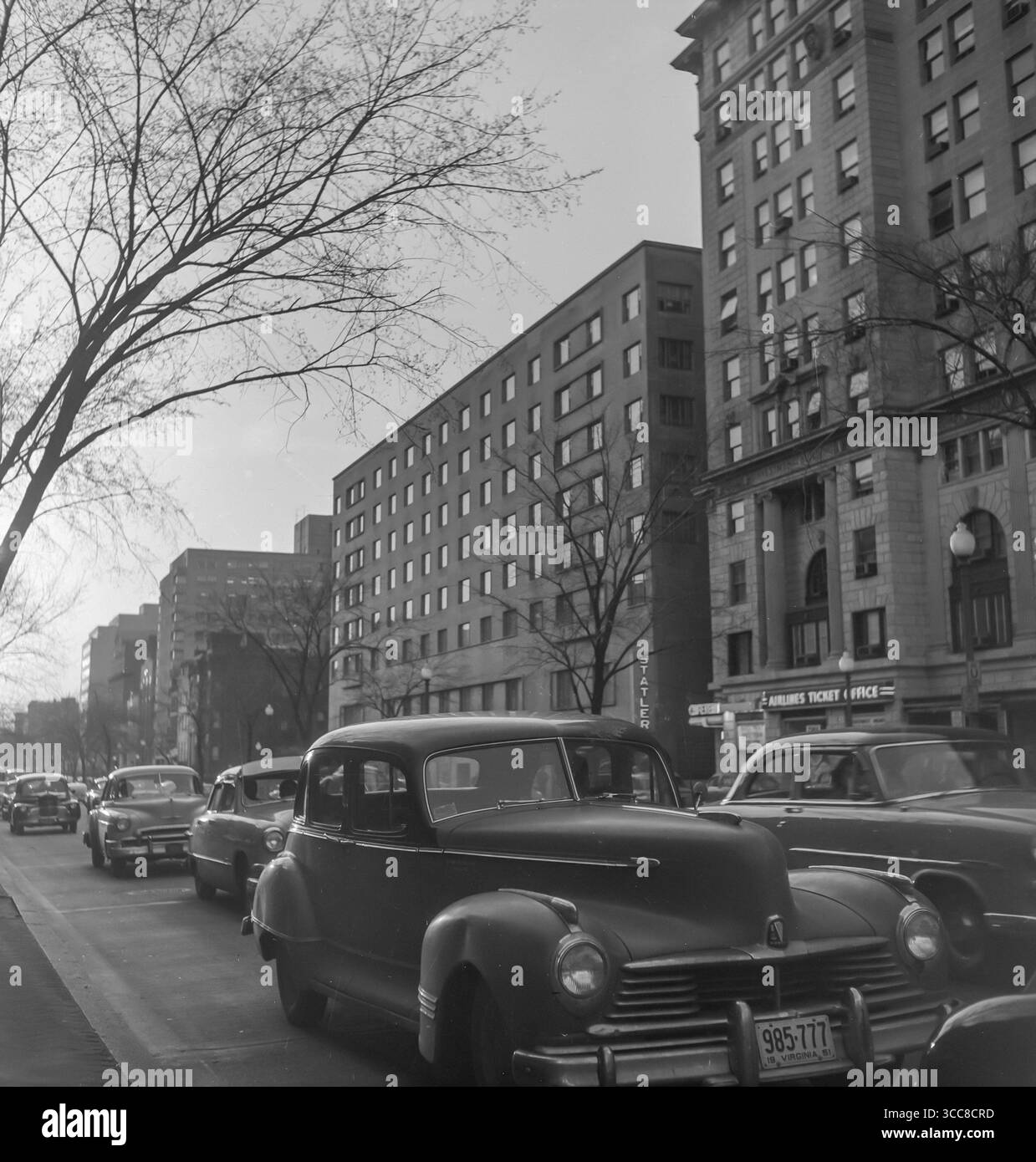 A vintage 1952 photograph showing cars and traffic on the streets of ...