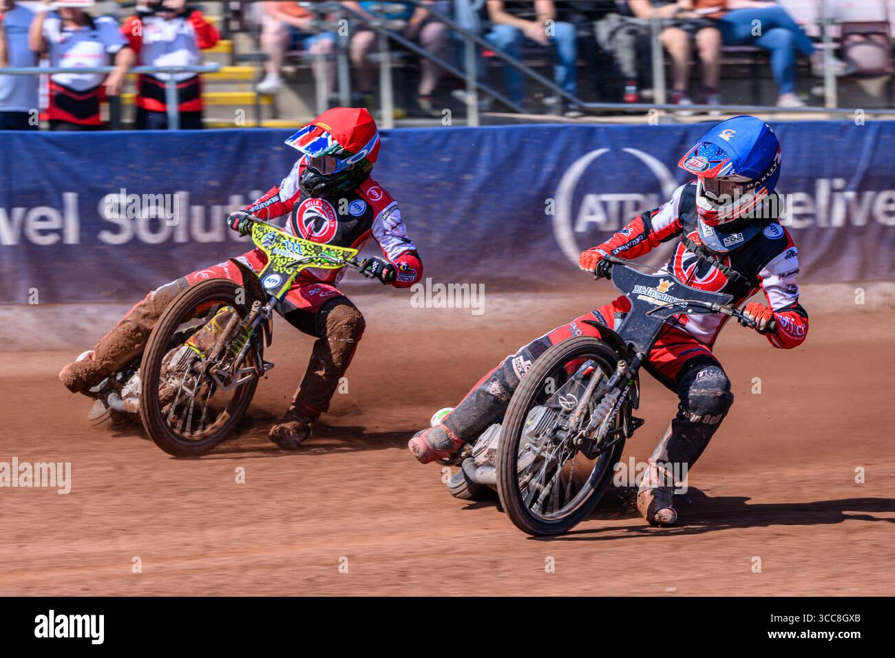 Freddy Hodder of Belle Vue Colts in Blue rides inside William Cairns of Belle Vue Colts in Red ...