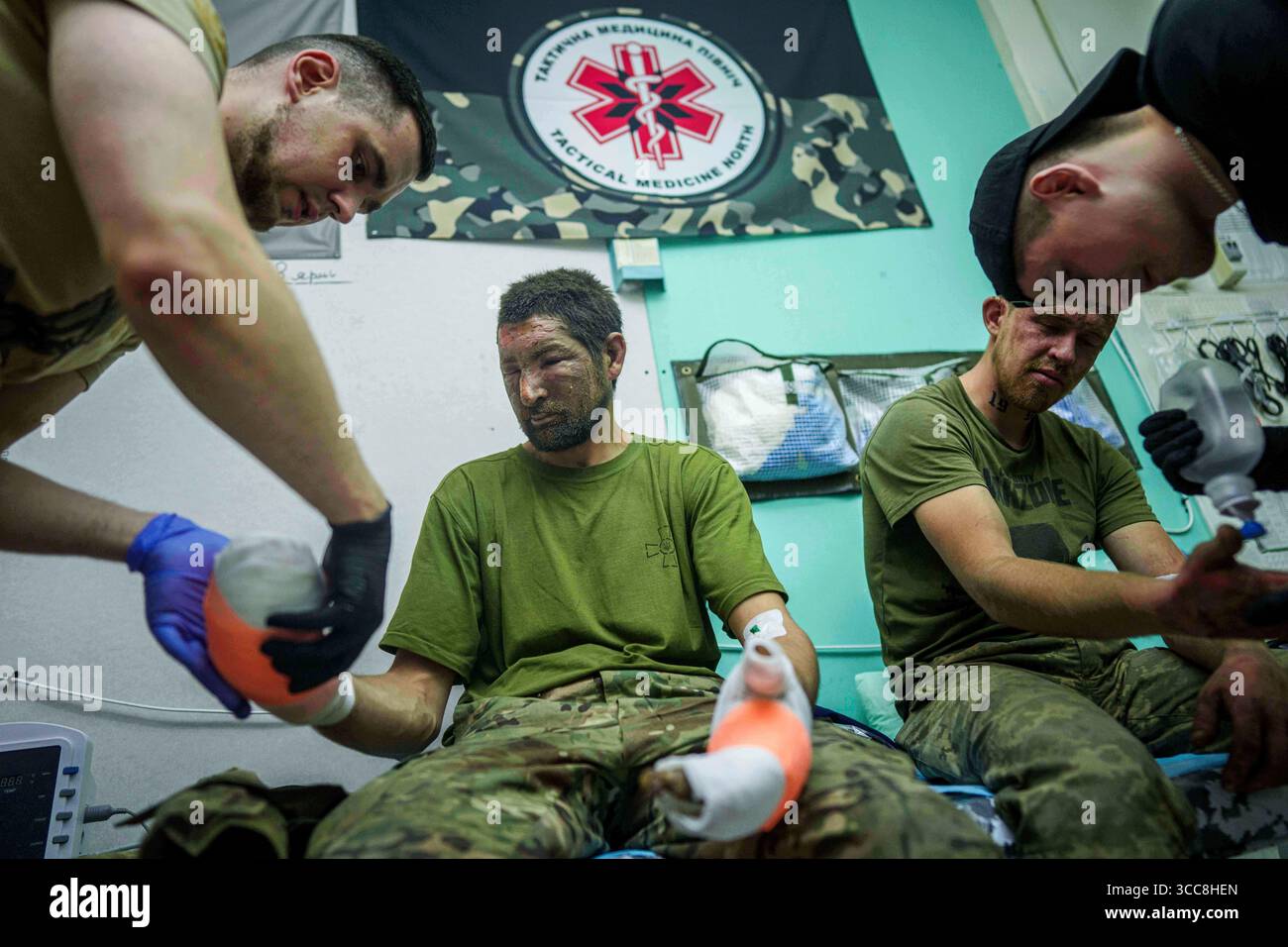 Ukrainian medics of Da Vinci Wolves Battalion treat their injured ...