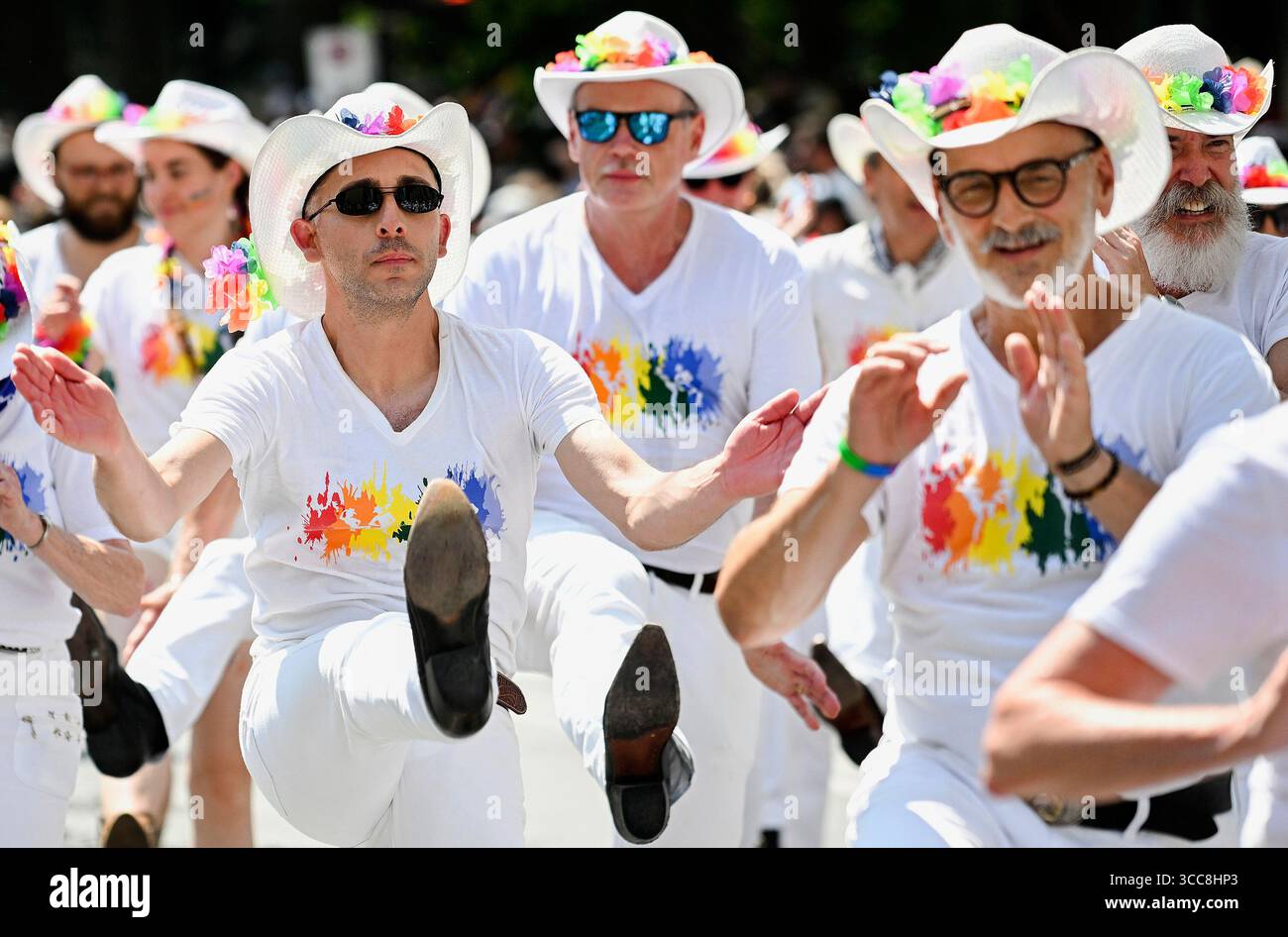 Participants entertain the crowd during the Pride parade in Montreal ...
