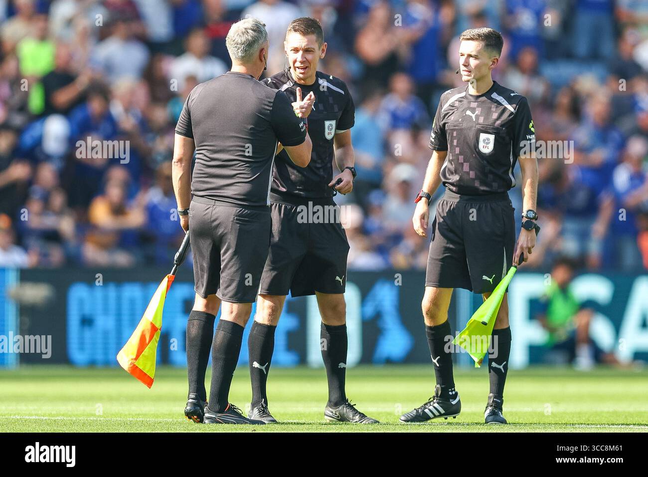 Referee, Matthew Donohue shakes hands with colleagues ahead of kick off ...