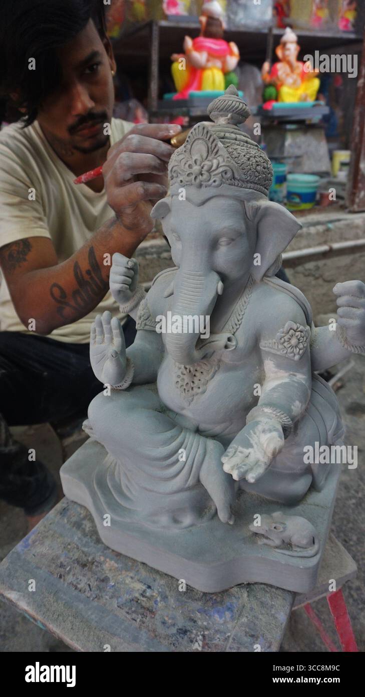 MUMBAI, INDIA - AUGUST 7: Artists are busy creating shadu clay idols of ...