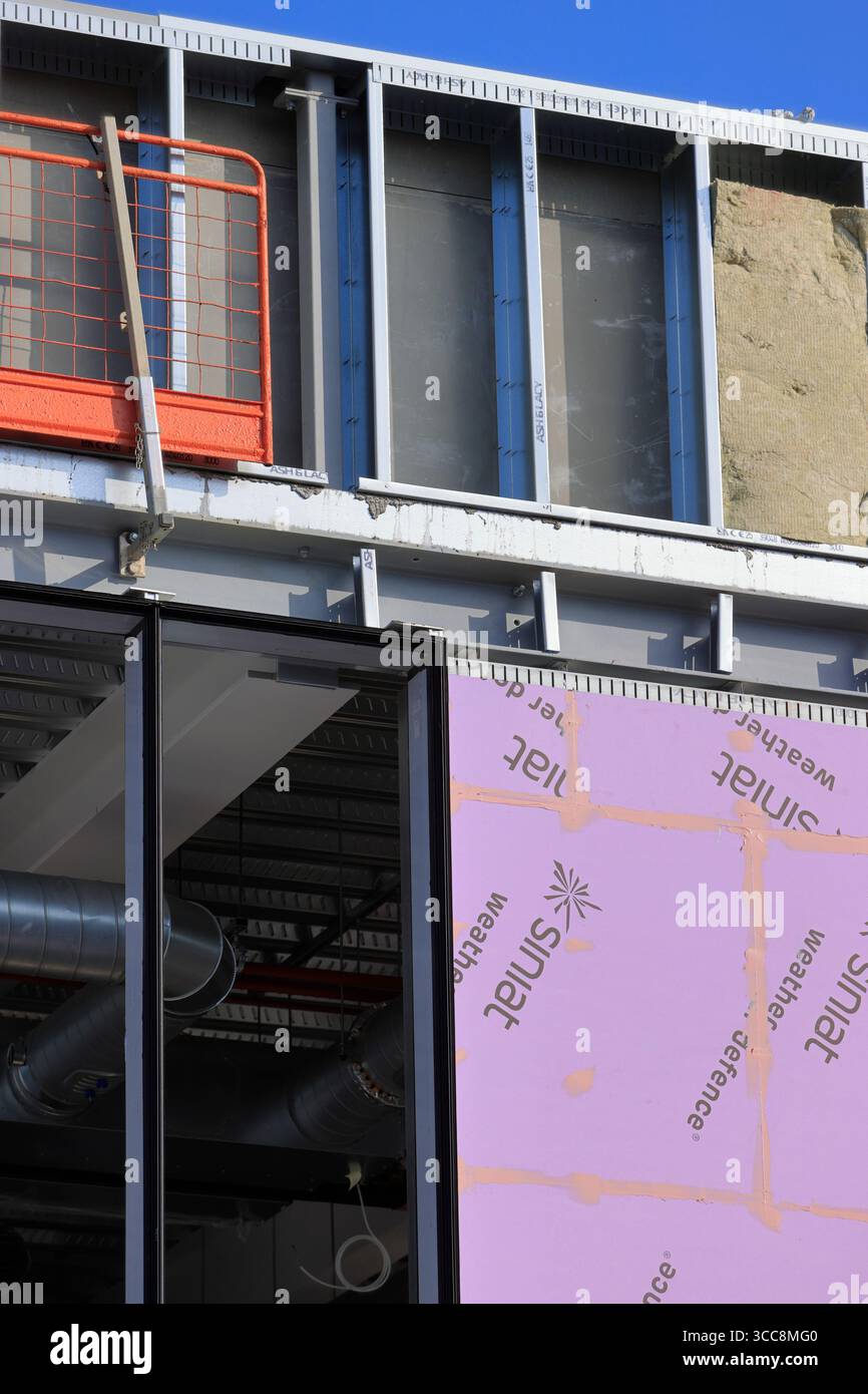 Weather defence backing boards installed on secondary steel frame hi ...