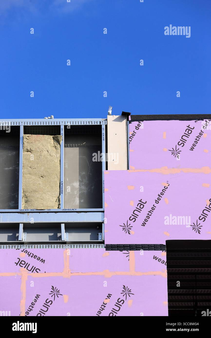 Weather defence backing boards installed on secondary steel frame hi ...