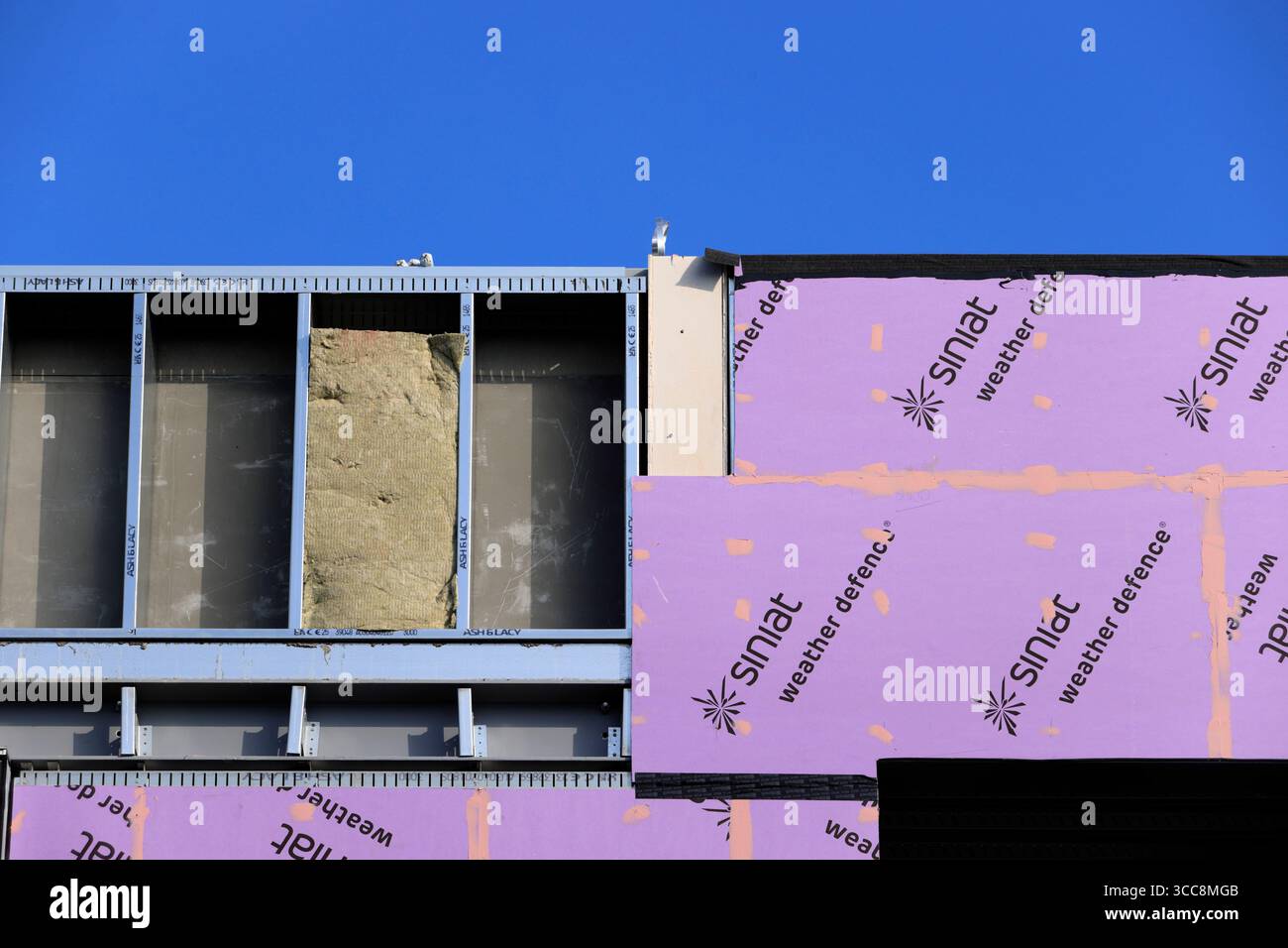 Weather defence backing boards installed on secondary steel frame, and ...