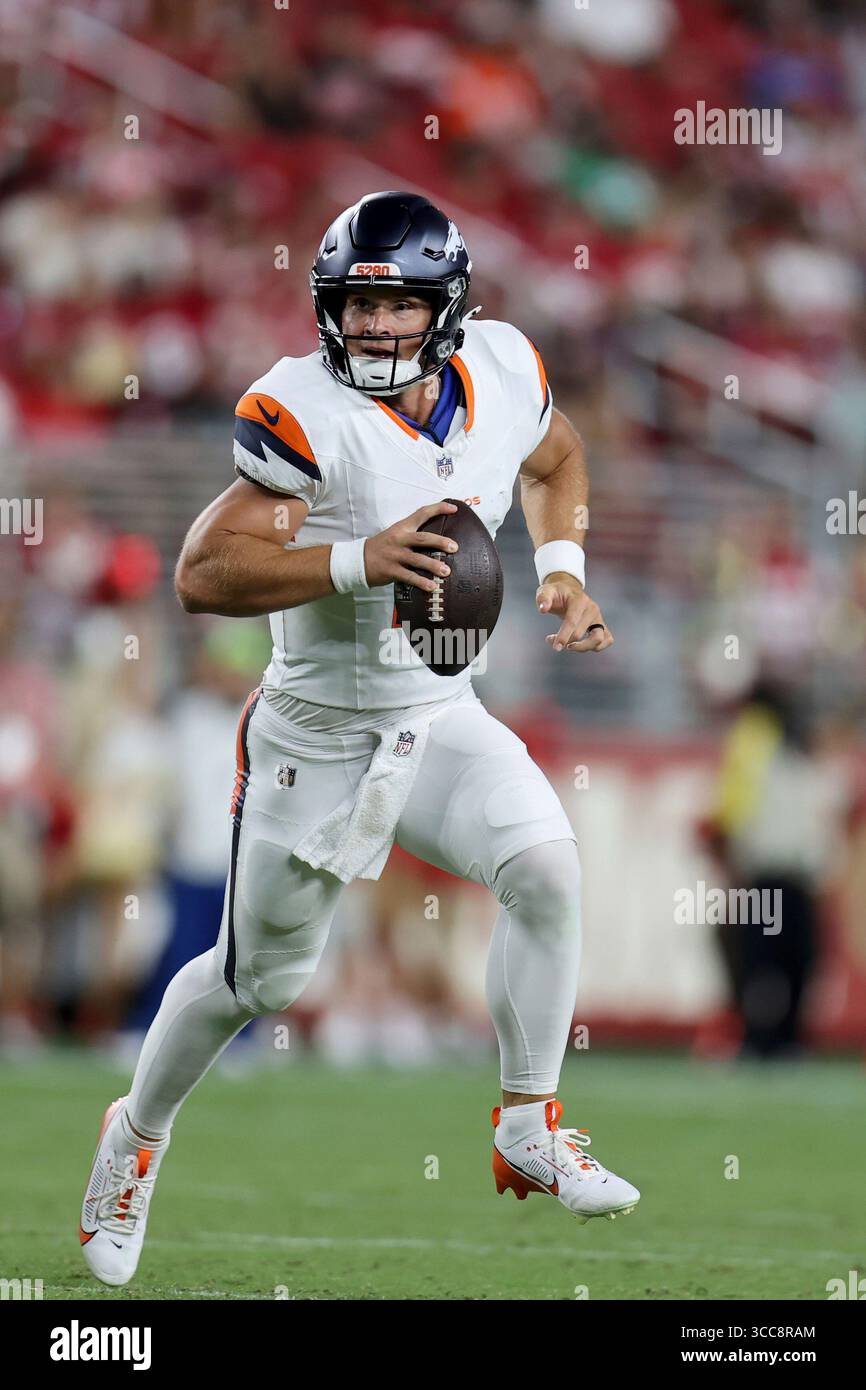 Denver Broncos quarterback Sam Ehlinger (4) runs during an NFL football ...