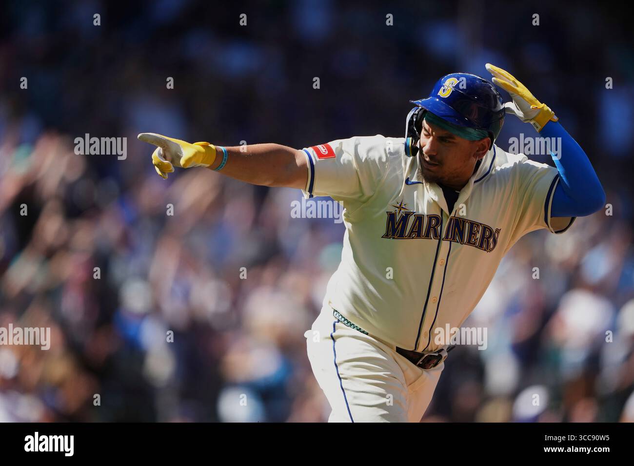Seattle Mariners' Josh Naylor points to the dugout after hitting a solo ...