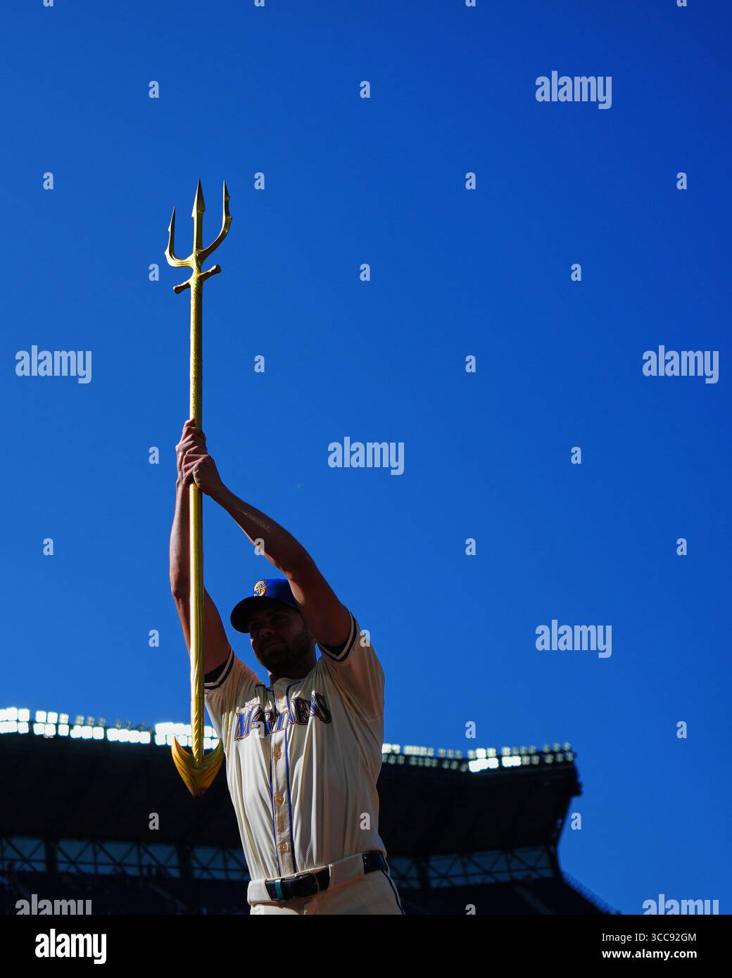 Seattle Mariners relief pitcher Matt Brash holds up the trident to ...