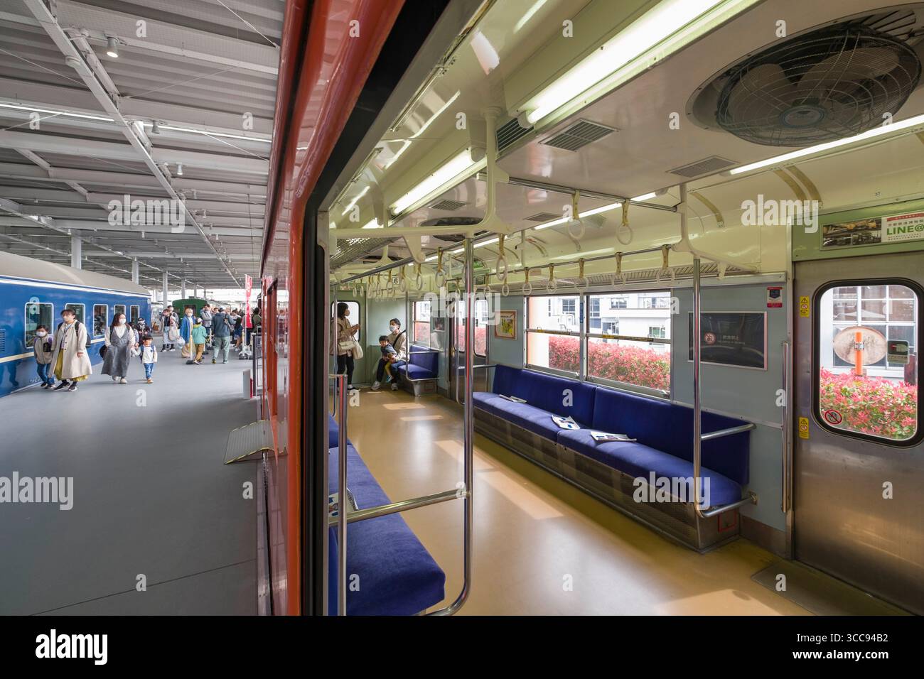 Visitors walking inside 103 series DC electric multiple unit (EMU ...