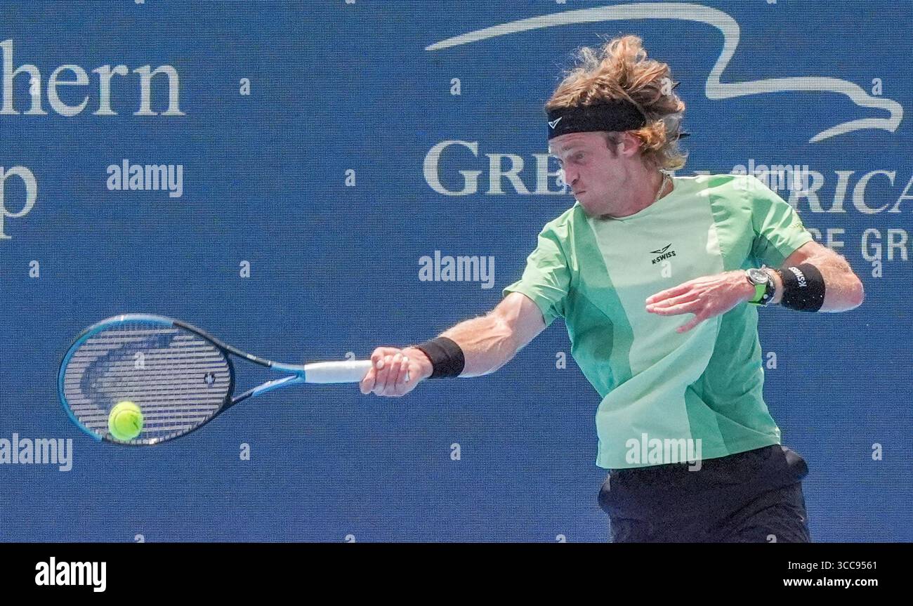 MASON, OH - AUG 10: Learner Tien (USA) returns a shot to Andrey Rublev ...