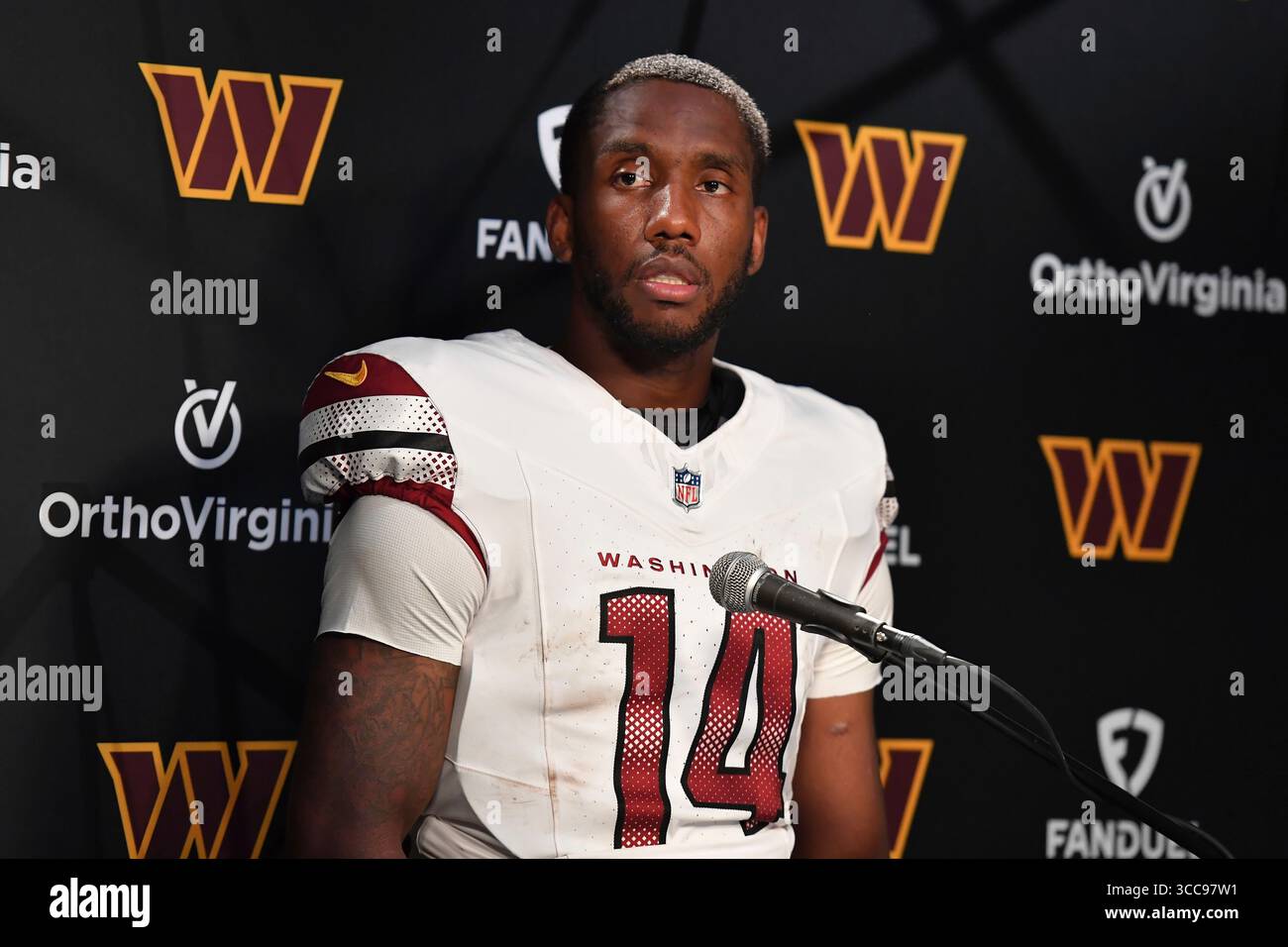 Washington Commanders quarterback Josh Johnson (14) faces reporters ...