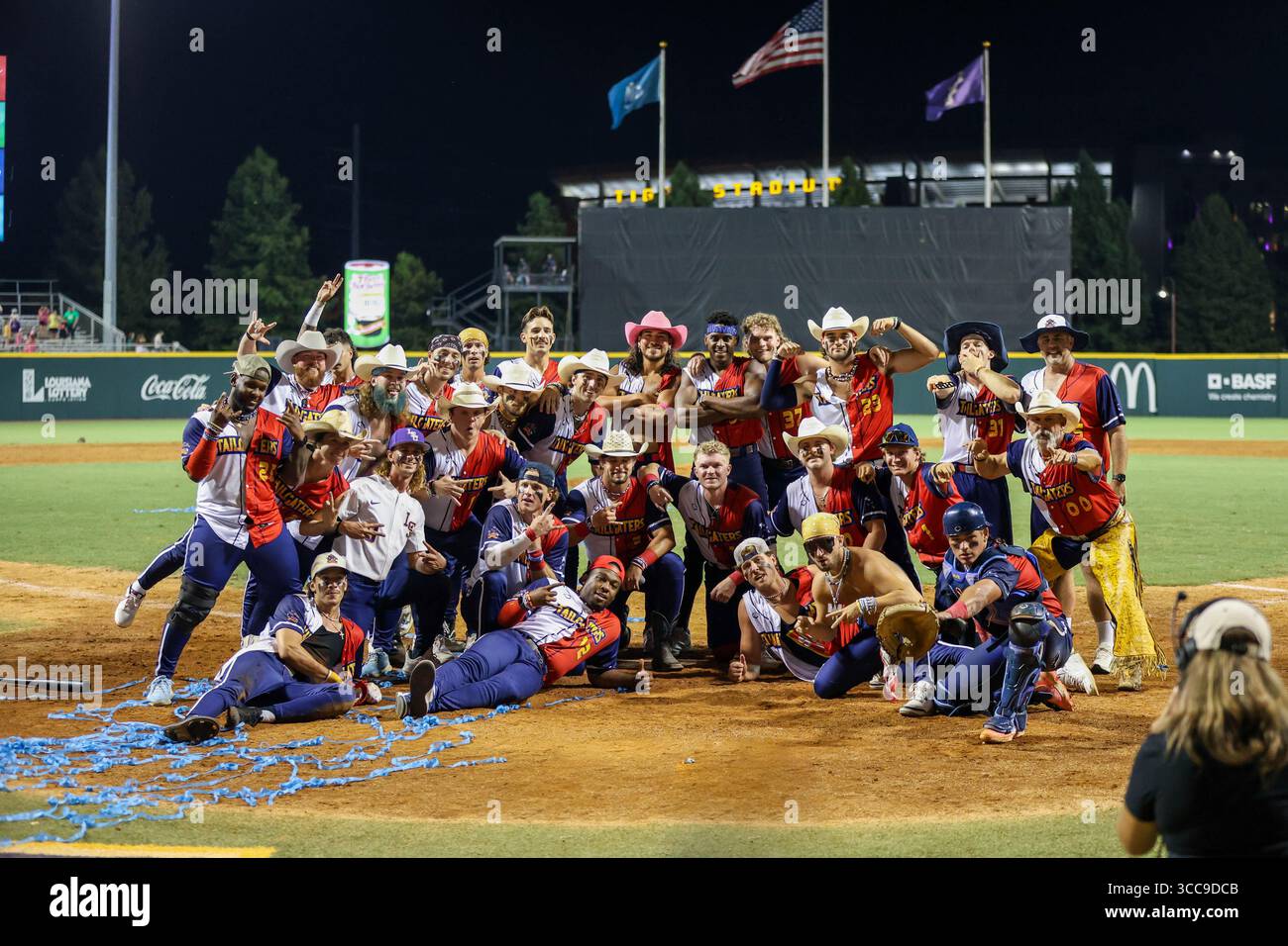 August 09, 2025: The Texas Tailgaters pose at home plate for a team ...