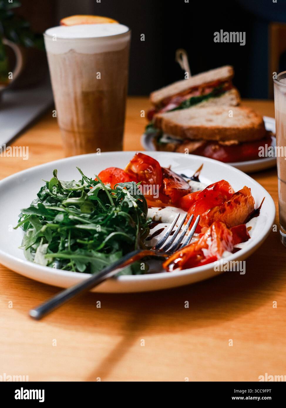 Cafe Lunch: Arugula–Tomato Salad with Drinks and Sandwiches Stock Photo ...