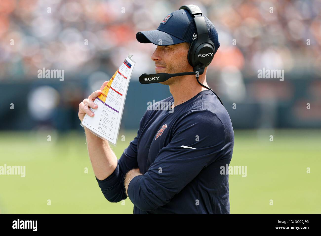 Chicago Bears head coach Ben Johnson coaches from the sidelines wearing ...