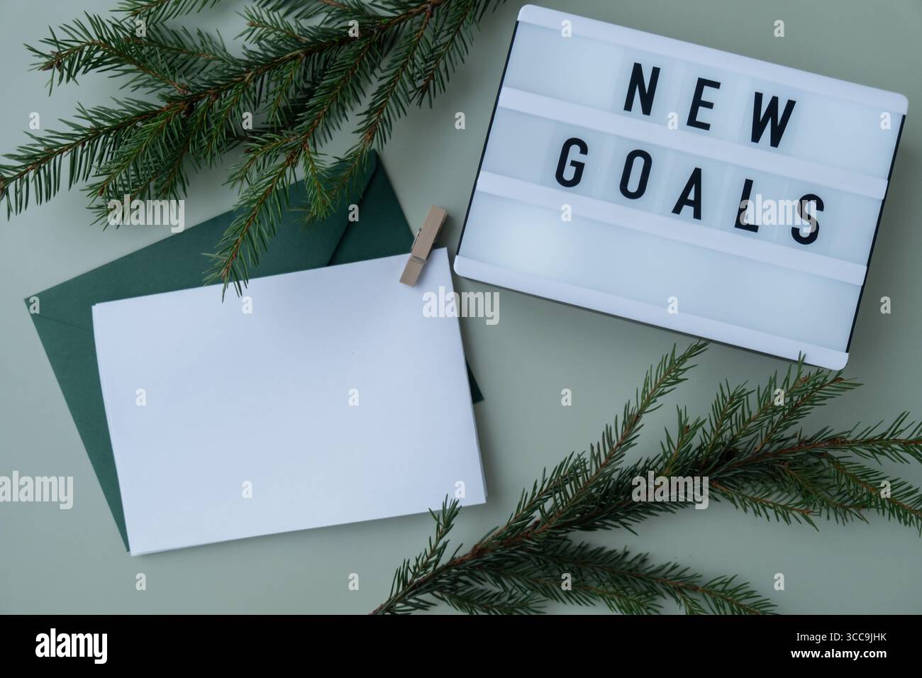 Motivational saying NEW GOALS with empty paper envelope note Copy space ...