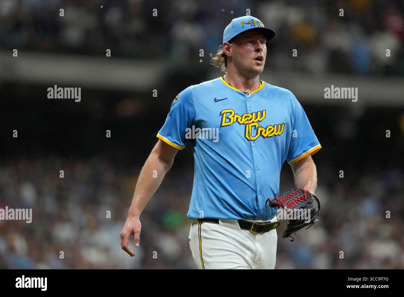 Milwaukee Brewers' Trevor Megill jogs to first base during a baseball ...