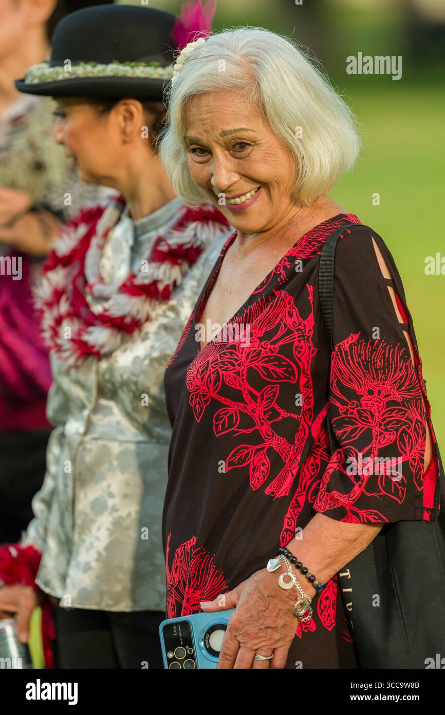 Smiling mature woman wearing Aloha attire before the start of the Aloha ...