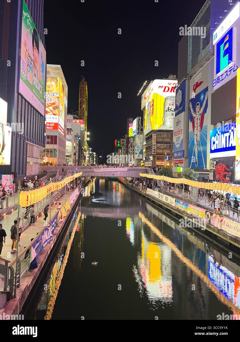 Night view of the Dotonbori canal in Osaka, Japan, with neon signs ...