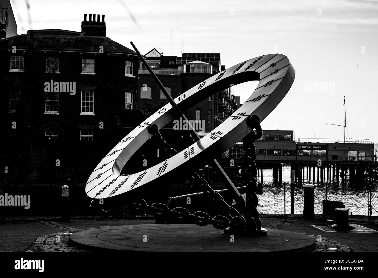 A large sundial stands prominently near Tower Bridge in London. The sun ...