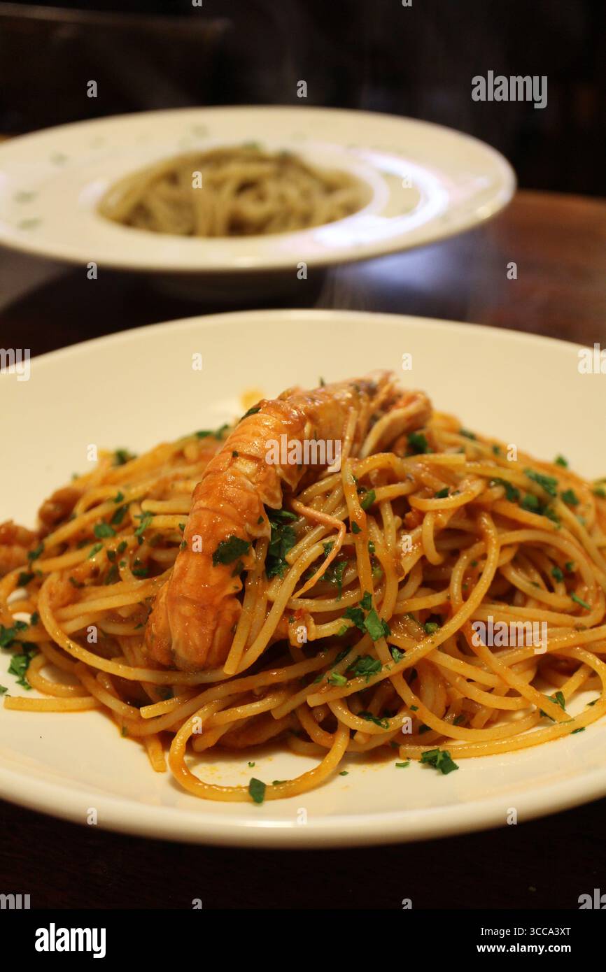 Italian cuisine: spaghetti alla busara (spaghetti with scampi and ...