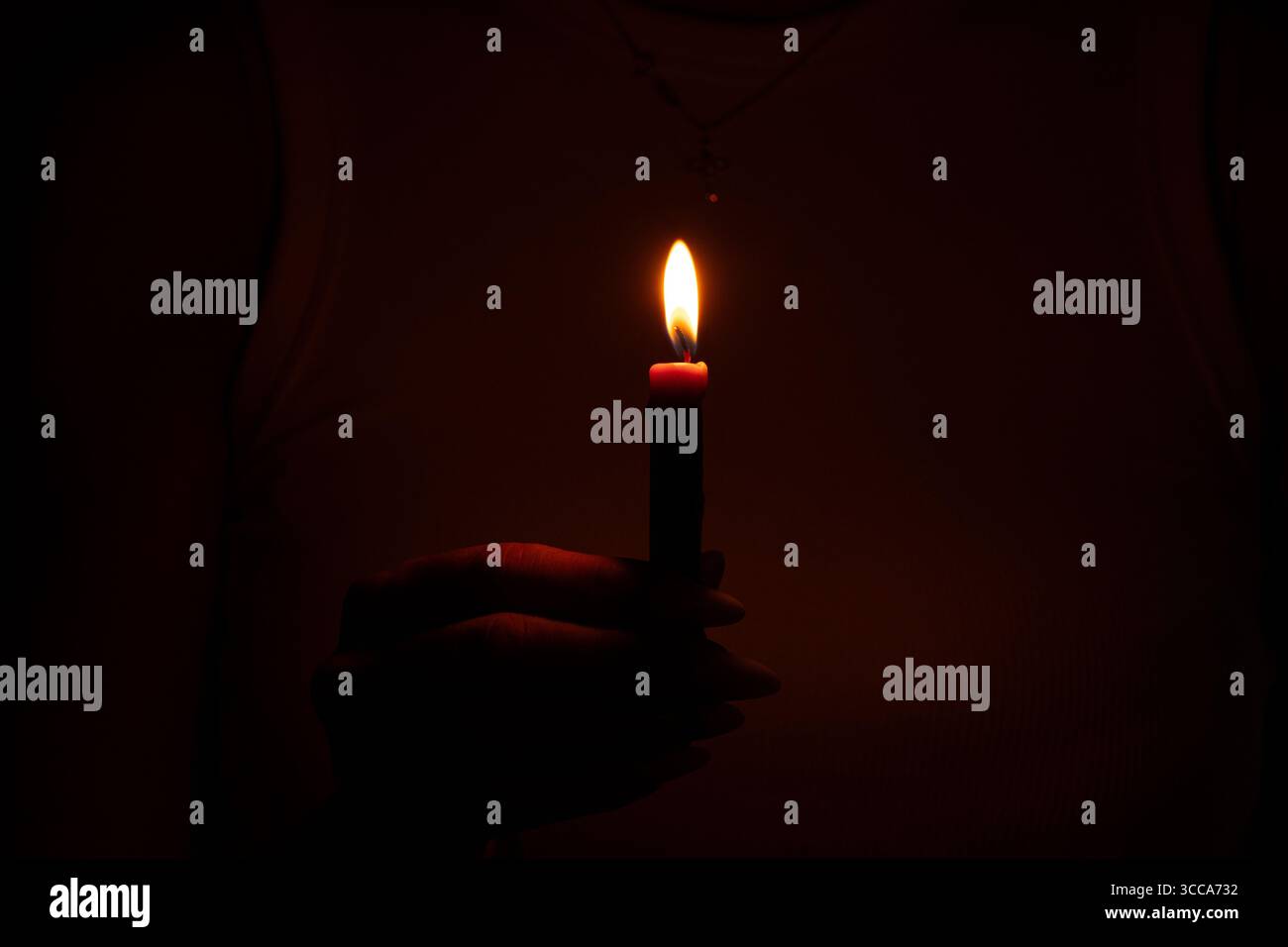 Candle flame illuminates female hi-res stock photography and images - Alamy