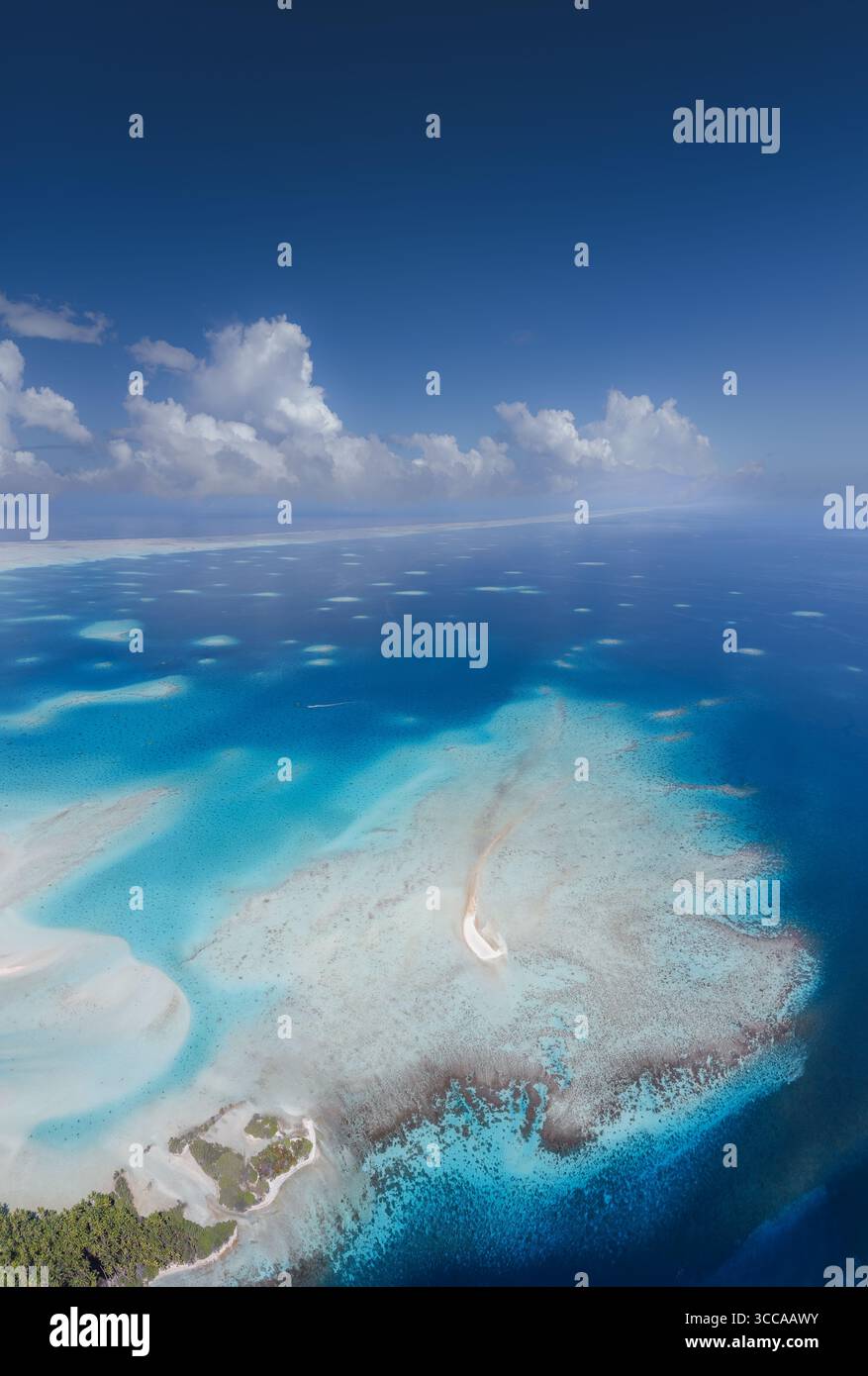 Aerial view of turquoise waters embrace a sandy island, the meeting ...