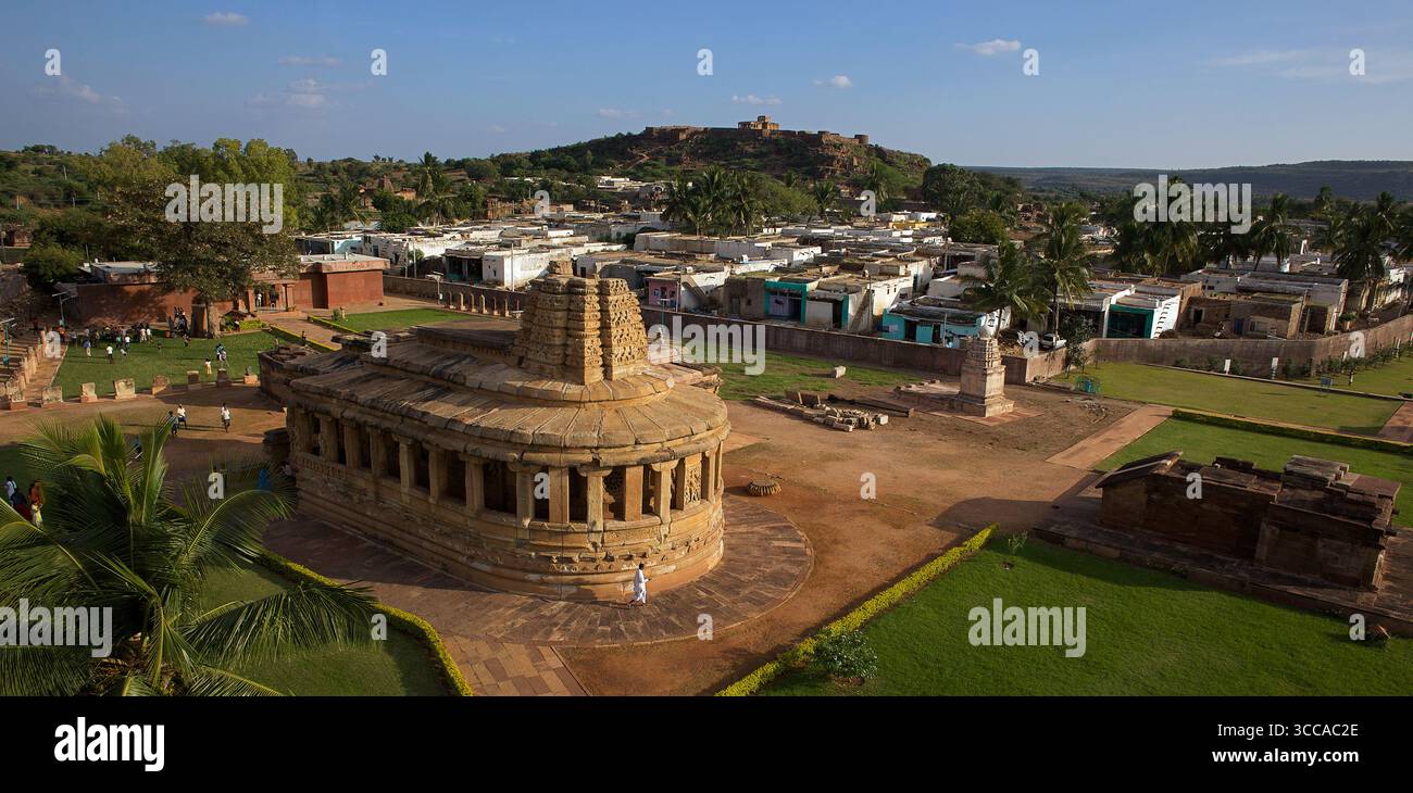 Aerial view of ancient stone temple contrasting with the village ...