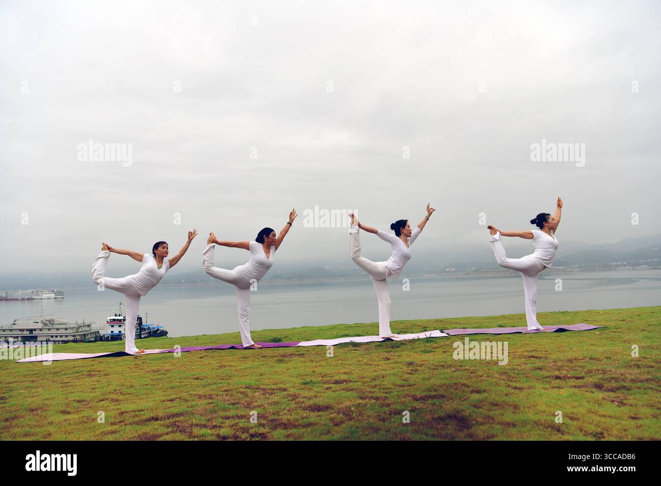 People practice yoga at a park in Yichang City, central China's Hubei ...