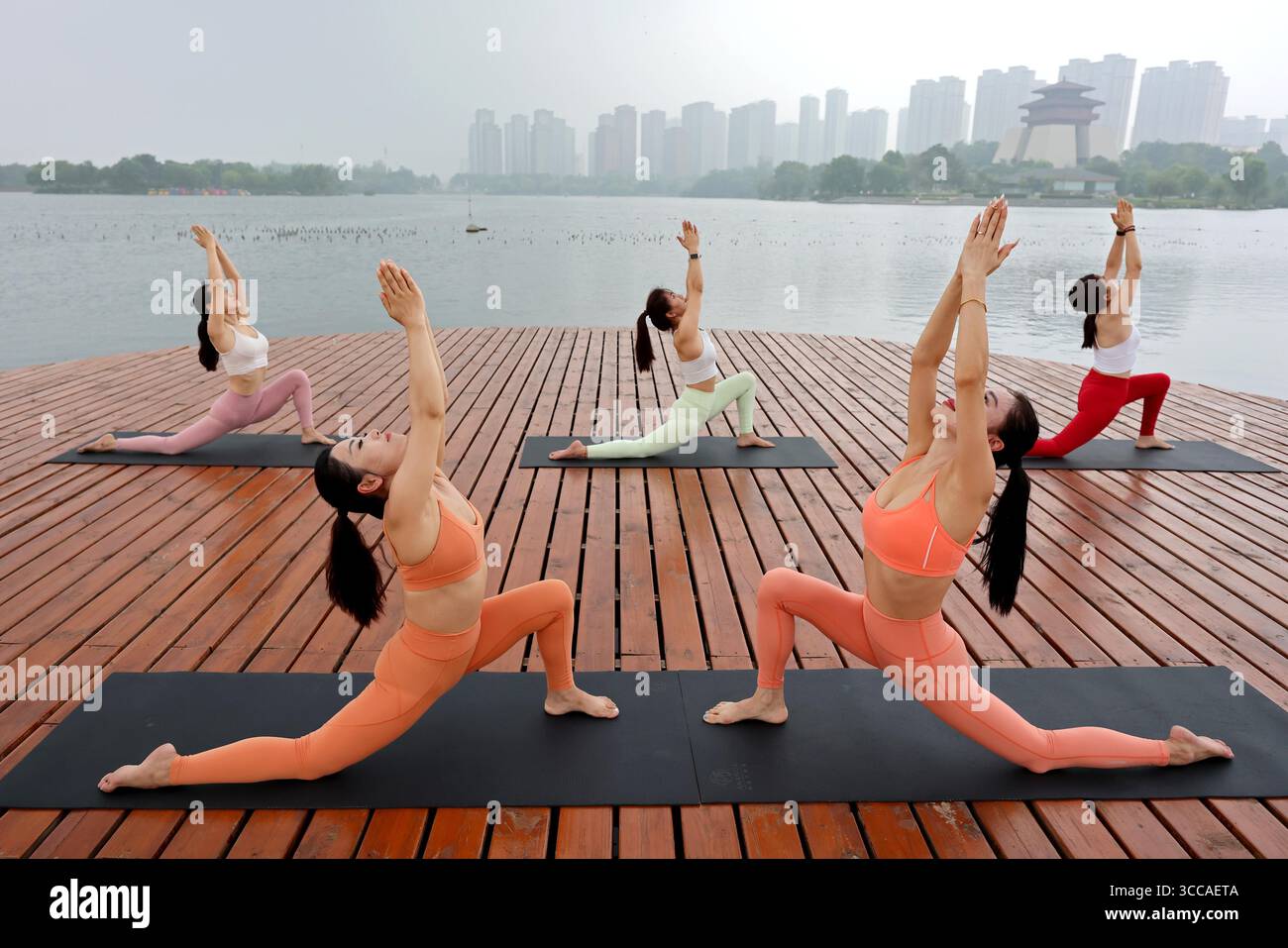 Citizens exercise at a park in Zaozhuang City, east China's Shandong ...