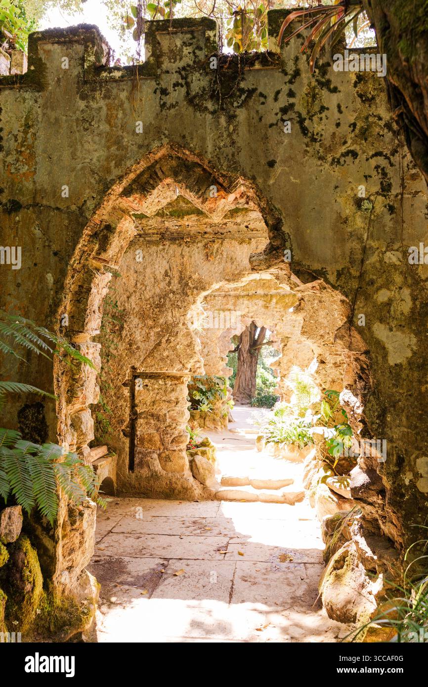 stone archway of romantic ruins in Monserrate Palace gardens Stock ...