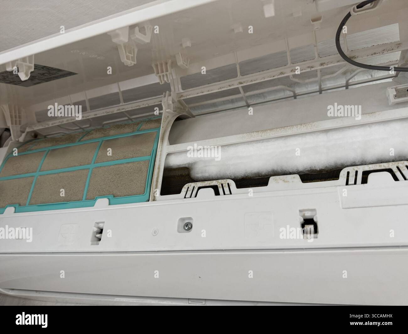 Ice on the air conditioner coil caused by a dirty air filter blocking ...