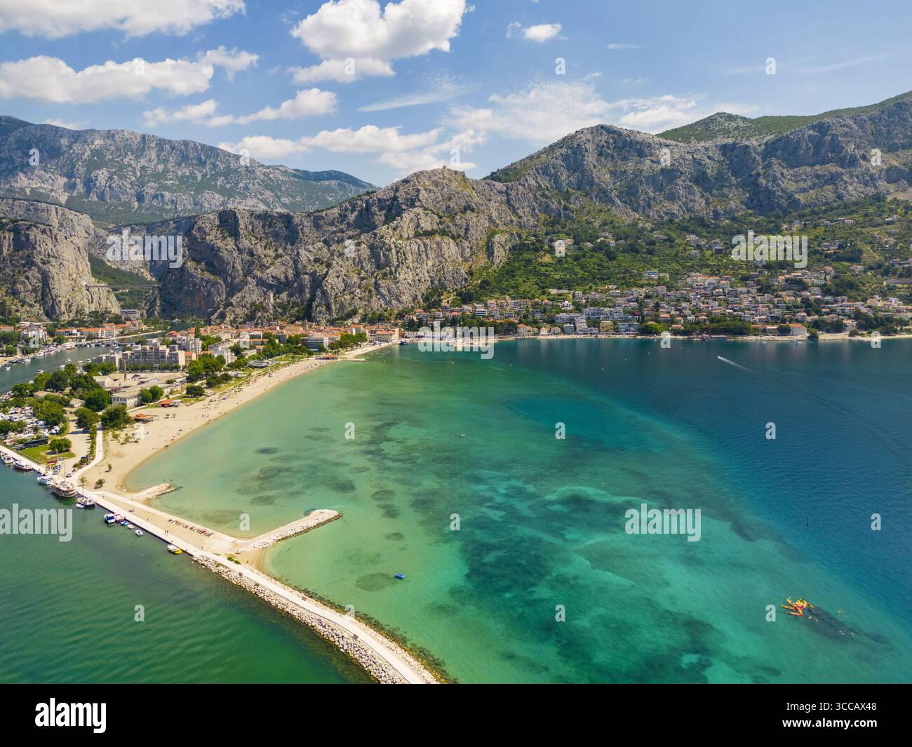 Aerial view of the stunning turquoise sea meeting the sandy beach, the ...
