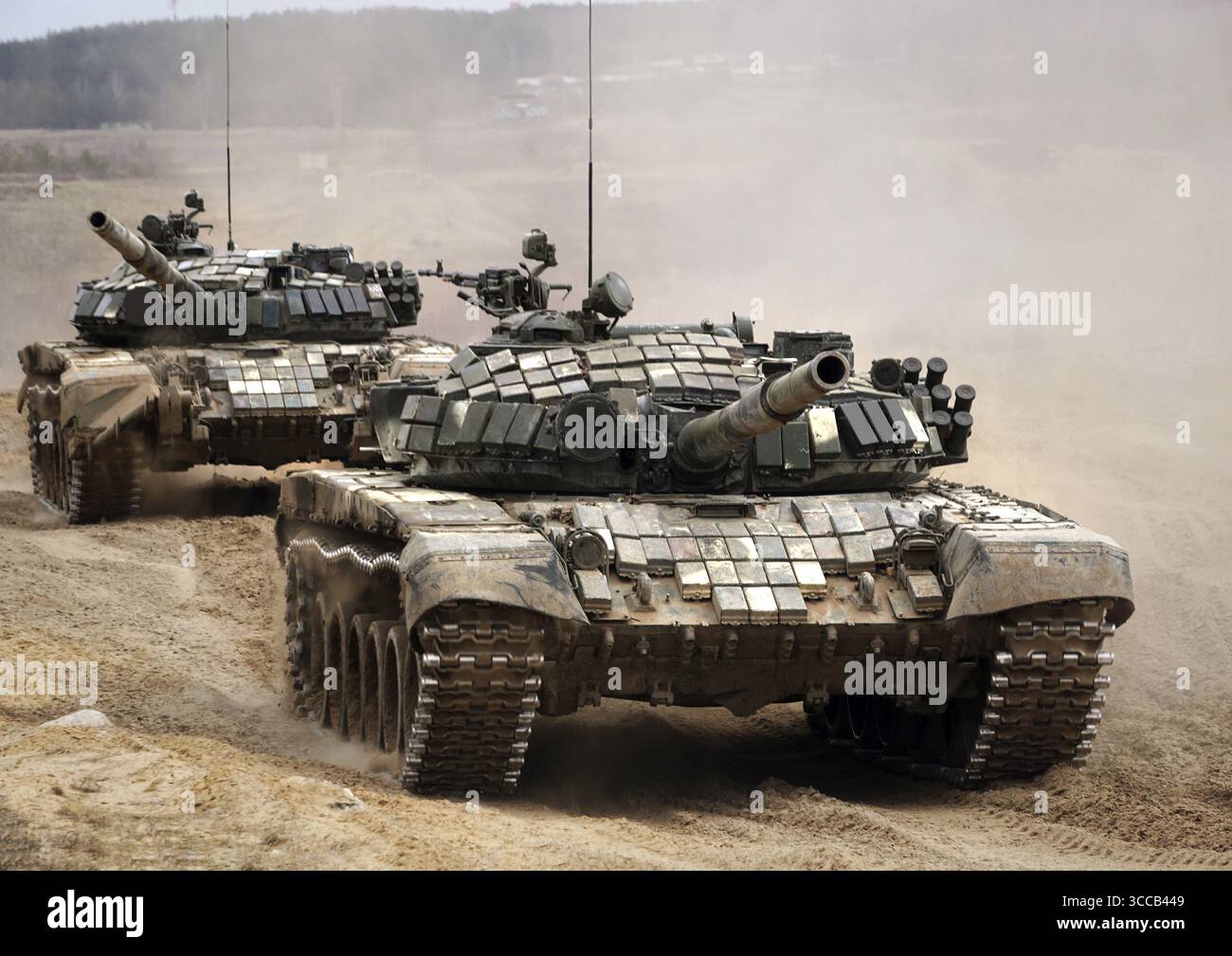 Powerful heavy fighting vehicle tank rides through the range during ...