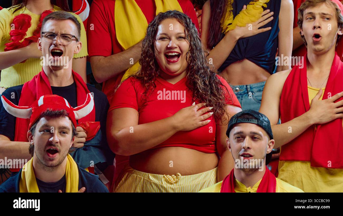 Diverse fans singing national anthem at stadium Stock Photo - Alamy