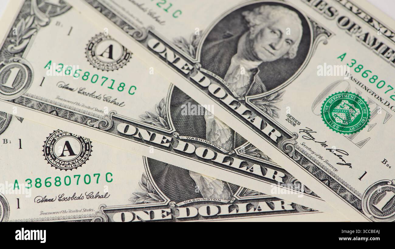 Three One Dollar Bills Are Neatly Arranged On A Flat Surface With Clear ...