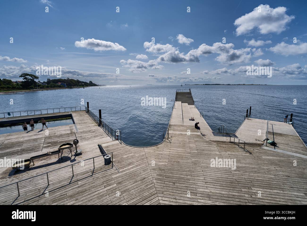 A scenic view featuring a distinctive wooden pier with stairs designed ...
