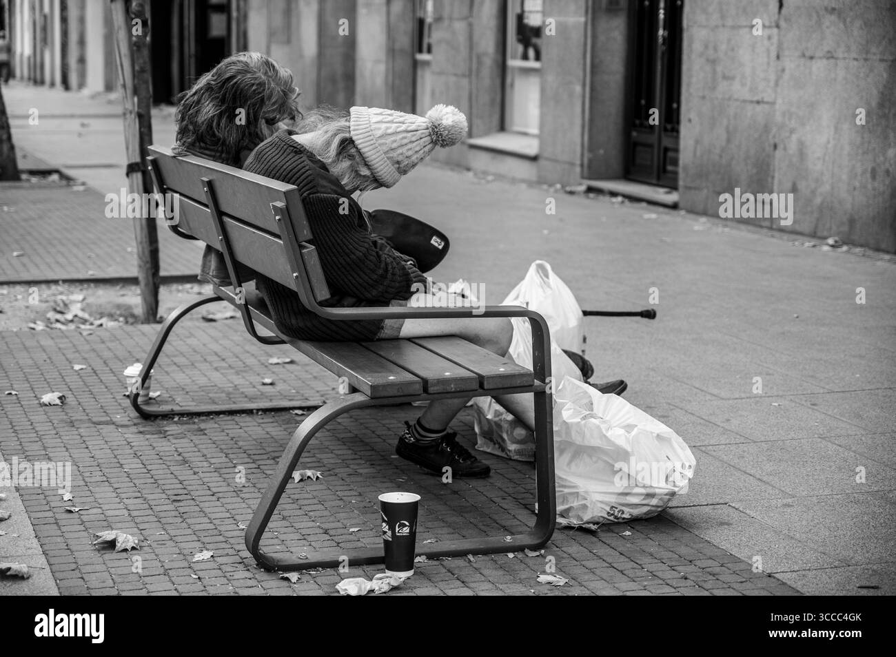 Homelessness bench Black and White Stock Photos & Images - Alamy