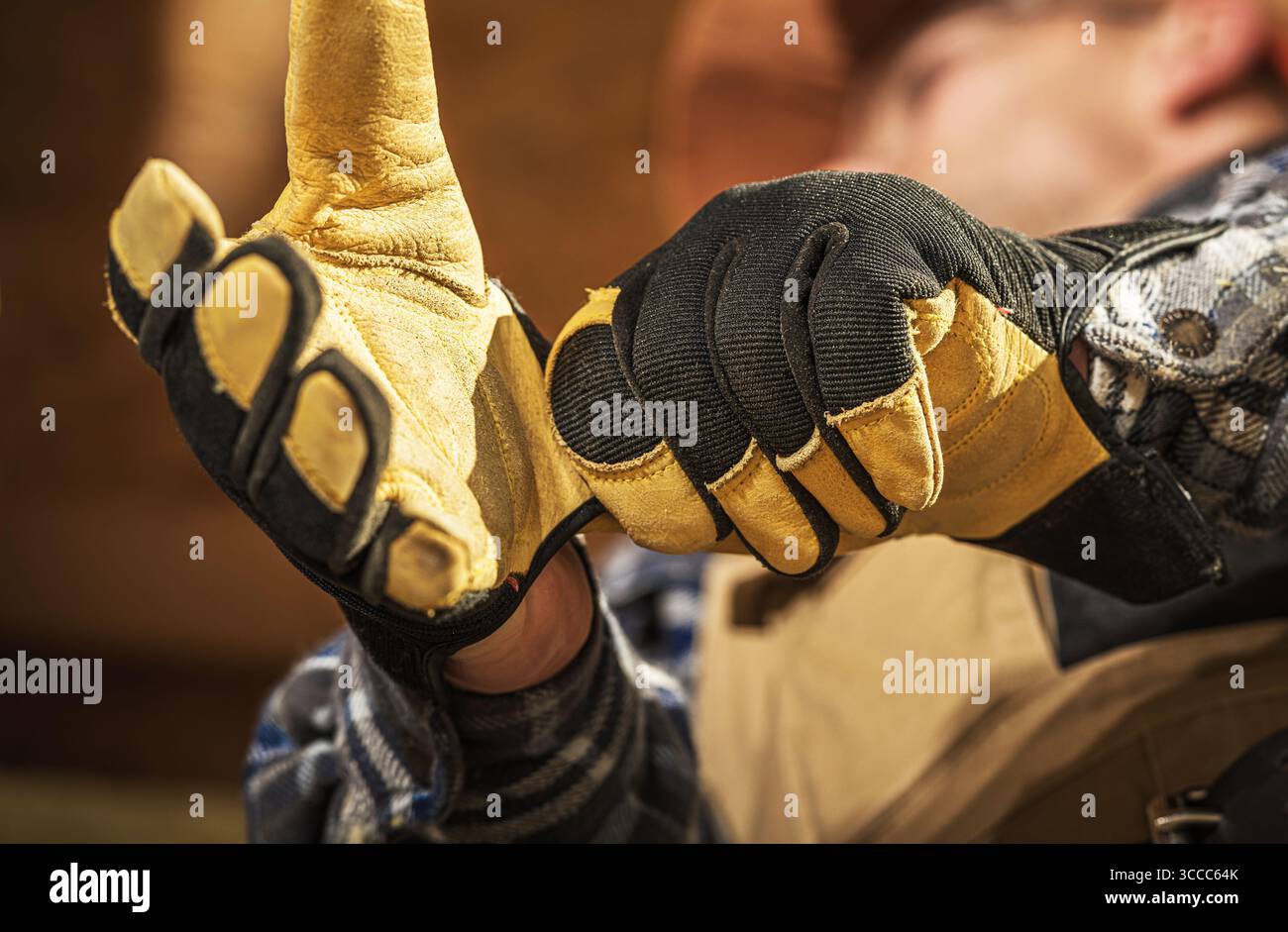 Worker in protective gloves showcases proper grip and control while ...