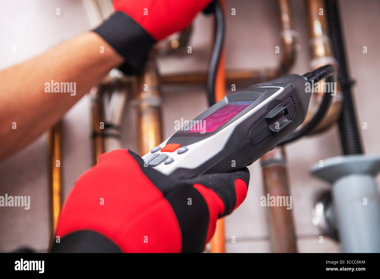Caucasian Technician Uses Advanced Gas Detecting Device to Inspect ...