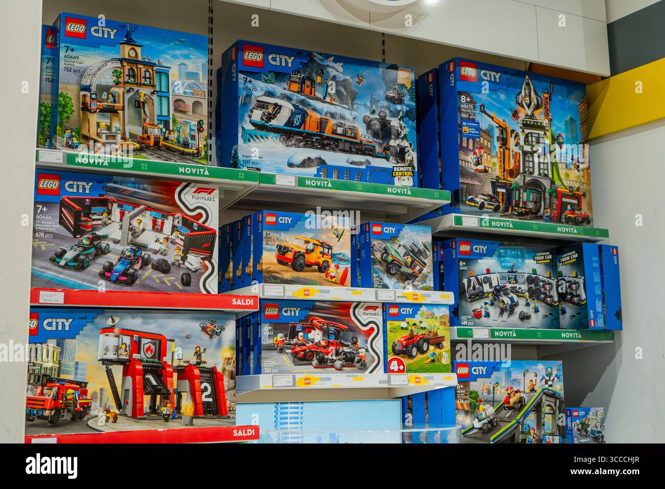 Boxes with construction sets on Lego store shelf. Shop sale Lego City ...