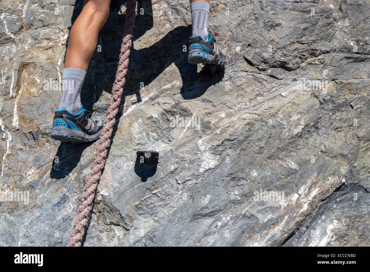 Mans legs cliff hi-res stock photography and images - Alamy