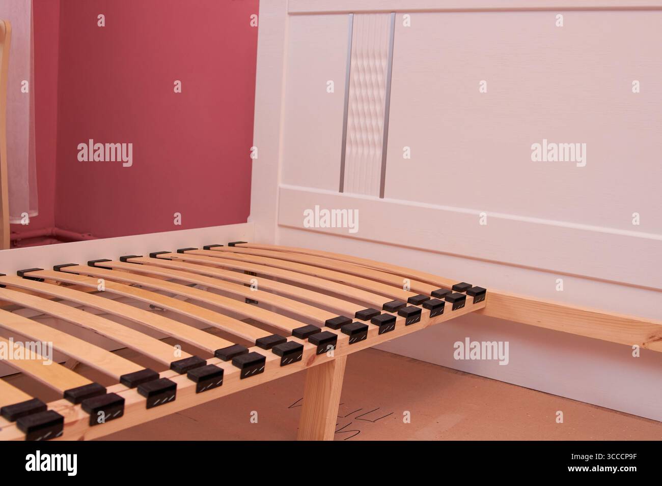 curved wooden slats for the bed, assembling the slats bed Stock Photo ...