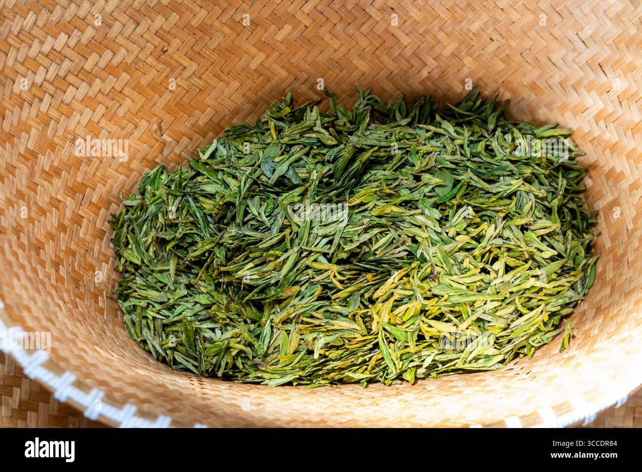 Withered longjing tea that has been pan-fried stored in rattan basket ...