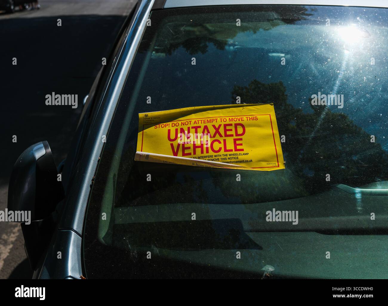 An untaxed vehicle is clamped Stock Photo - Alamy