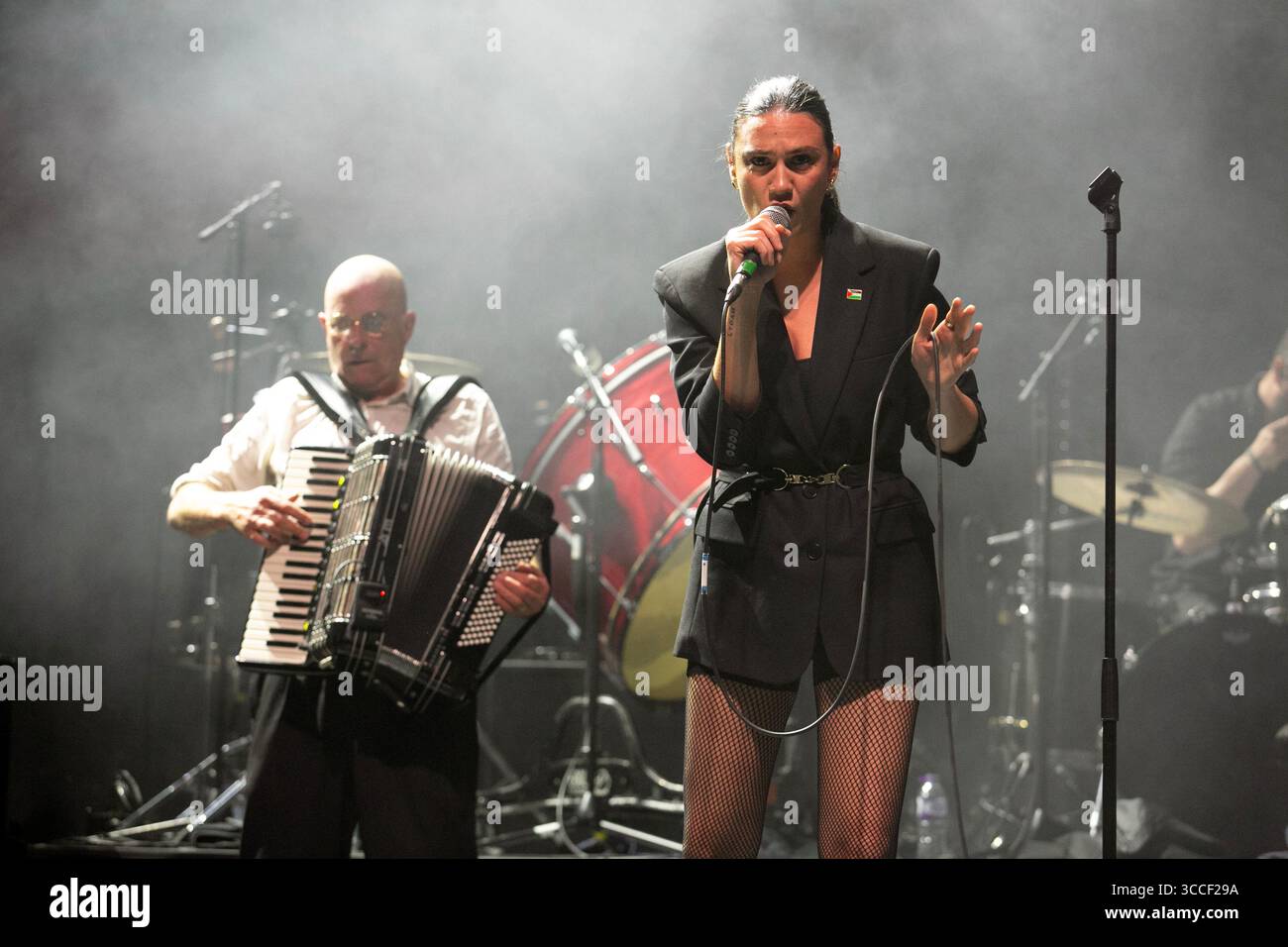 Singer Nadine Shah performing on stage with the Pogues at O2 Apollo in ...