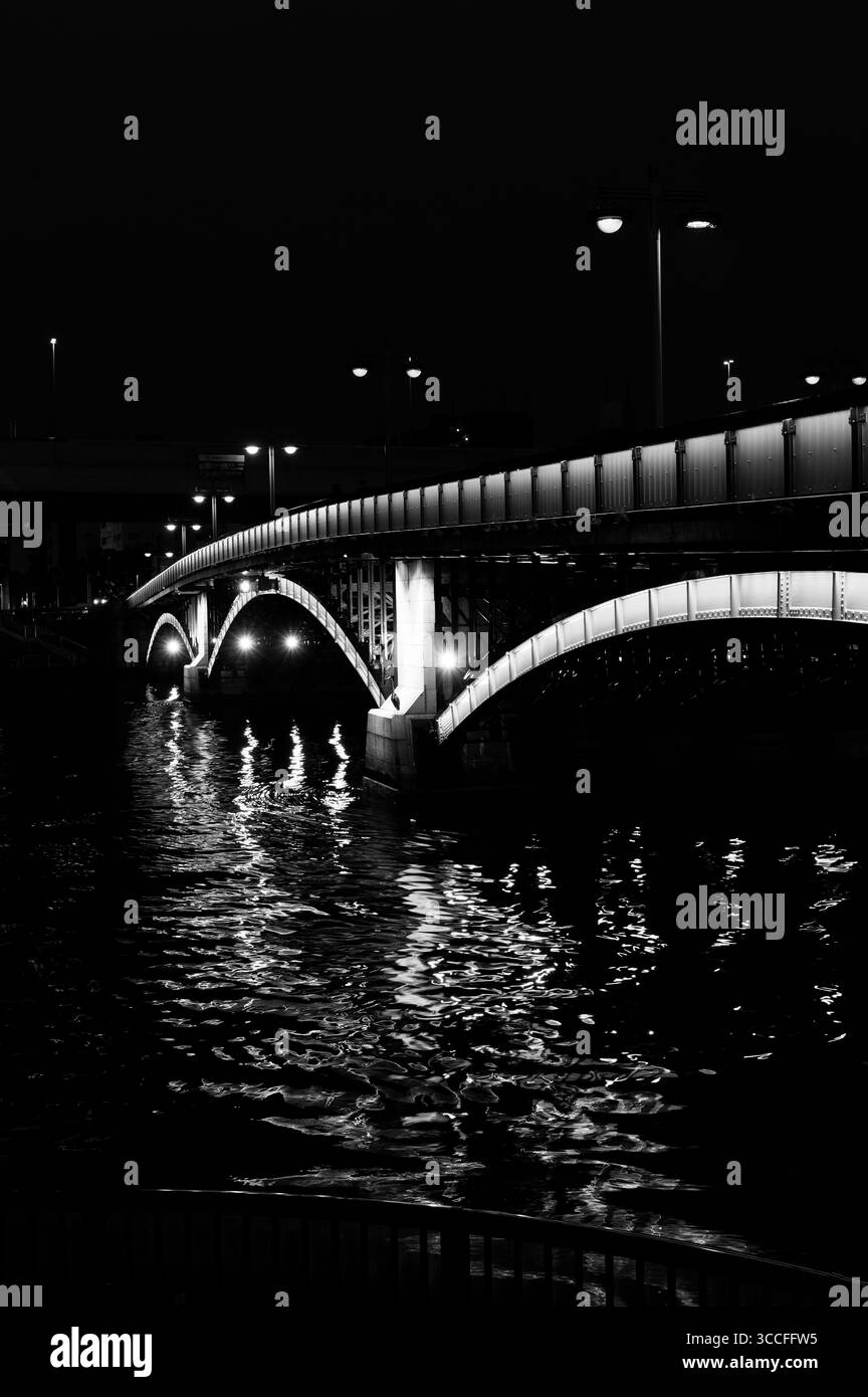 Black and white night view of the Azuma Bridge over the Sumida River in ...