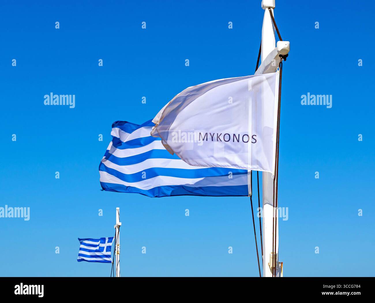 Greek flag waiving on wind outside on Mykonos island Stock Photo - Alamy