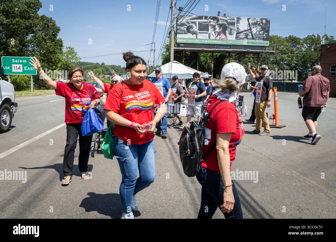 August 8, 2025. Peabody, MA. Striking waste management workers walk the ...