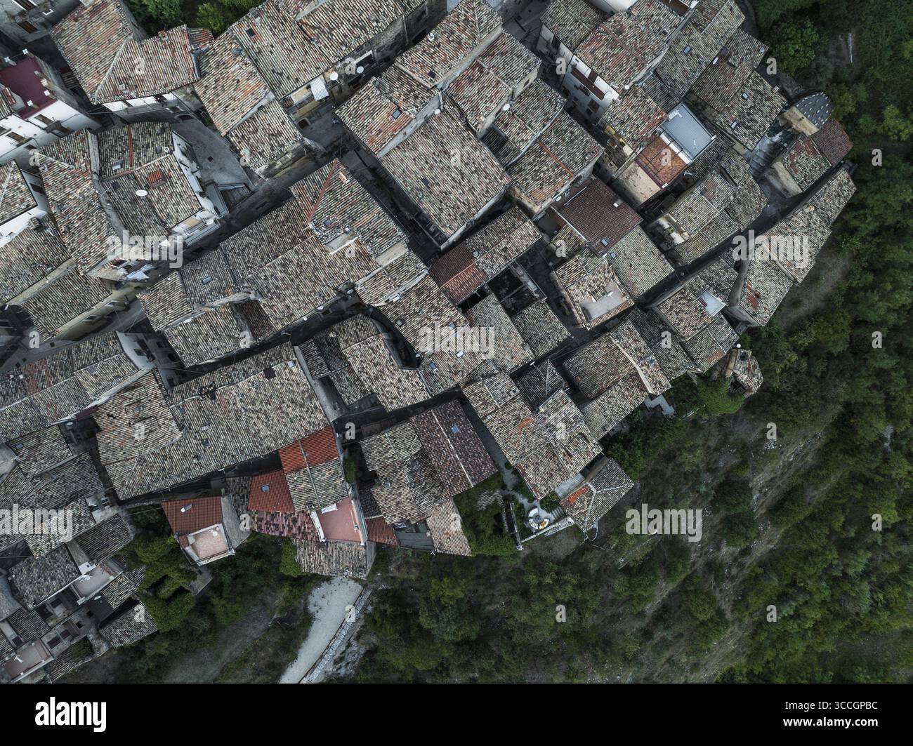 Aerial view of the clustered rooftops of Pacentro cascade down the ...