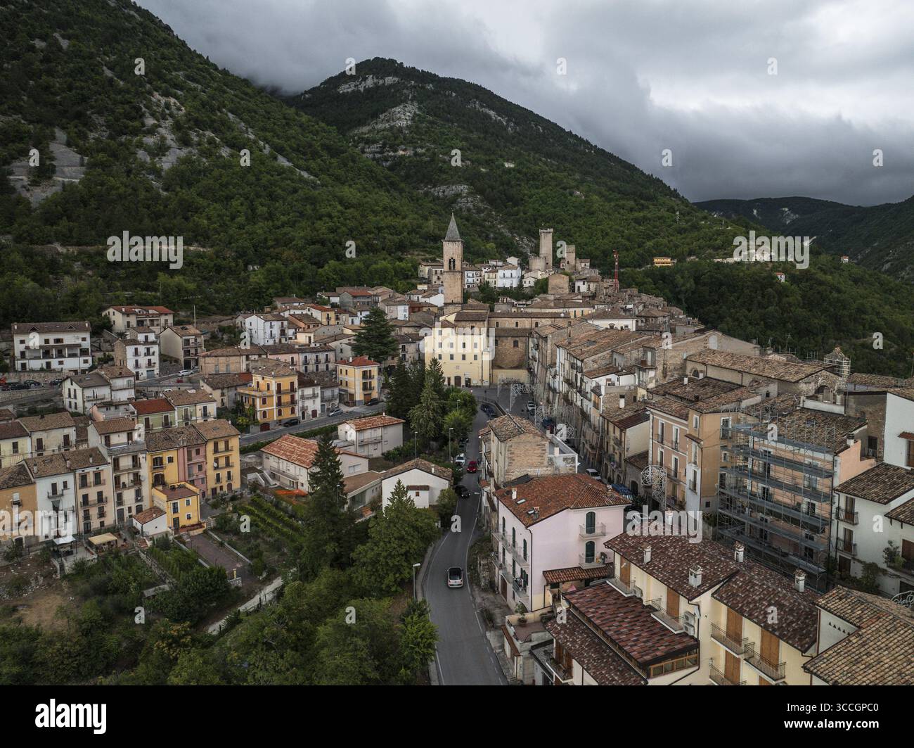Aerial view of the charming village nestled amidst rolling green hills ...